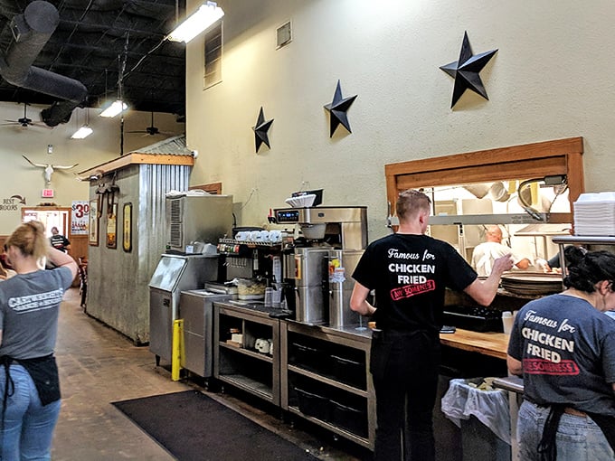 The staff sporting "Famous for Chicken Fried Steak" shirts aren't just employees—they're ambassadors of Texas comfort food, working their magic behind the counter.