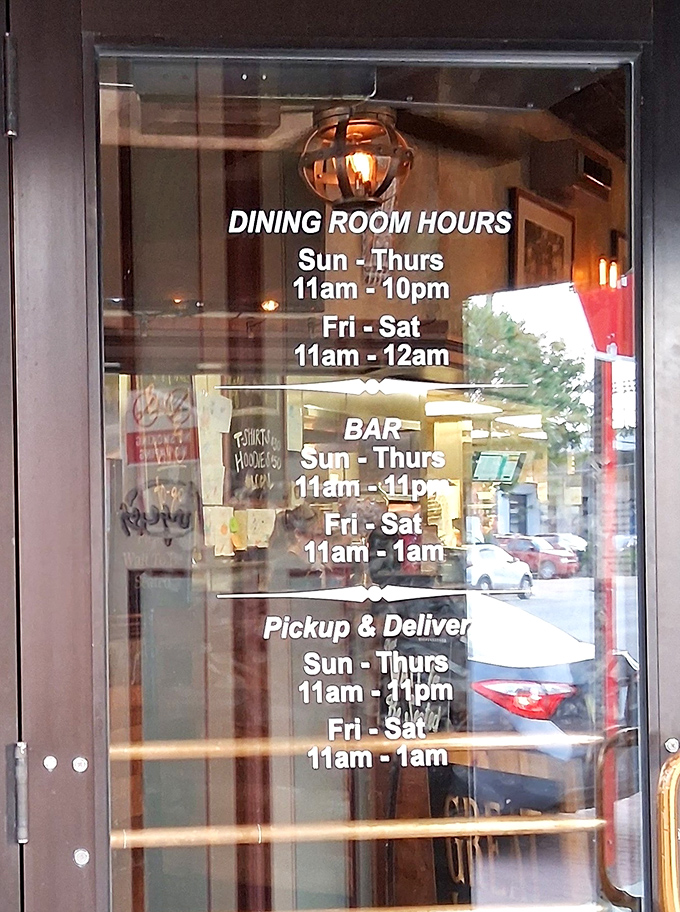 Hours posted like a promise—because knowing exactly when you can get your wing fix is information as essential as your WiFi password.