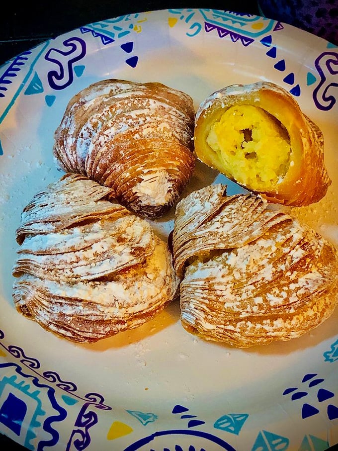 Sfogliatelle – those ridged, shell-shaped pastries with the impossible-to-pronounce name and the impossible-to-forget custard filling that's worth the tongue-twisting order.