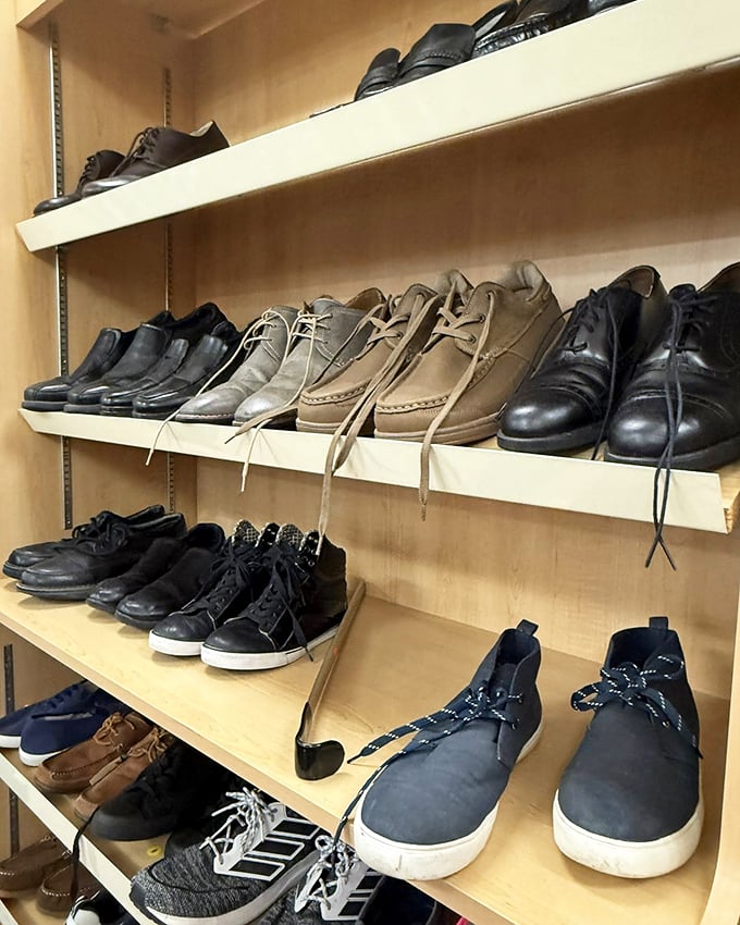 Shoe section offers everything from business meetings to weekend adventures. Barely-worn leather oxfords next to practical sneakers.