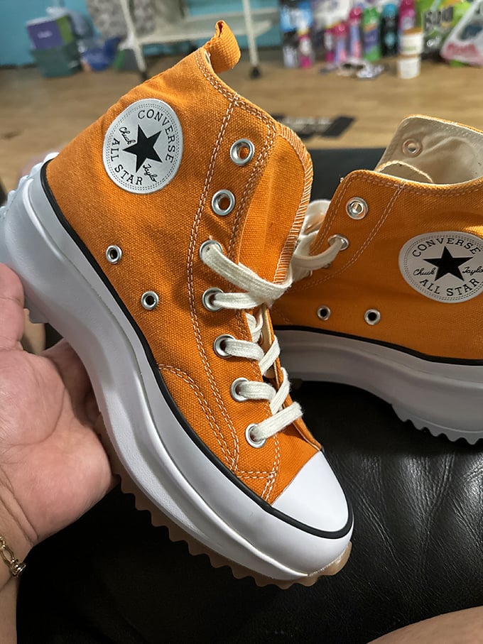 These orange Converse aren't just shoes—they're personality on feet, waiting for their second chance at making a statement.