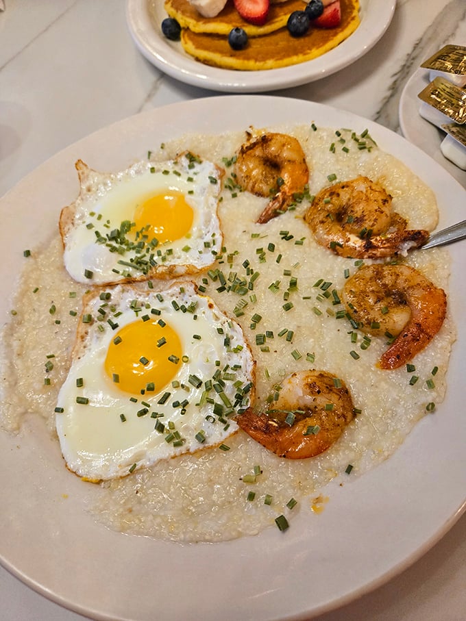 Shrimp and grits with sunny-side-up eggs—where Southern comfort meets Philadelphia hospitality on a single magnificent plate.