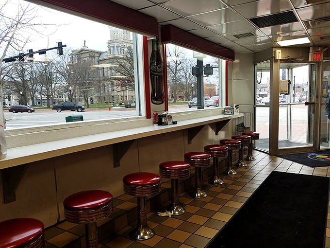 Counter seats offering front-row views to downtown Sidney and the courthouse—dinner with a show, small-town Ohio style.