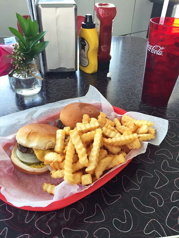 Cherry-red Coca-Cola and classic burgers with fries—the diner trinity that's been making Americans happy since cars had tailfins.