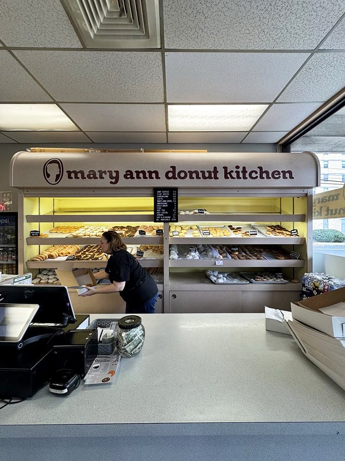 Behind the counter where pastry dreams come true. Like watching artists at work, except the canvas is edible and delicious.