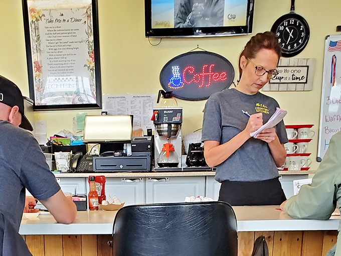 Order-taking is serious business when people's omelet dreams are on the line—note the concentration worthy of a heart surgeon.