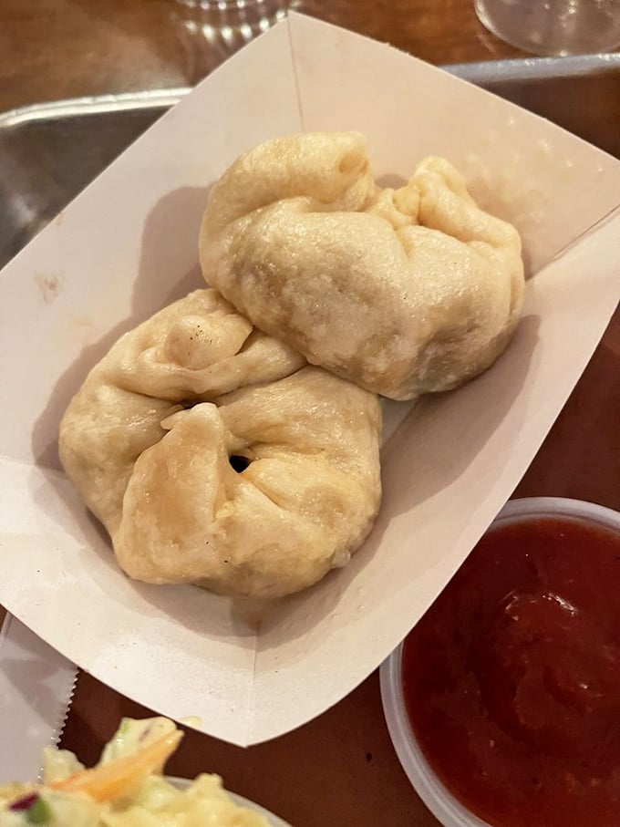Pillowy steamed buns waiting to be dipped in that vibrant sauce – Eastern technique meets Western flavors in perfect harmony.