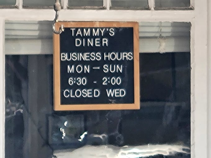 The hours sign tells you everything you need to know—open early, closed by afternoon, and everyone deserves a Wednesday off.
