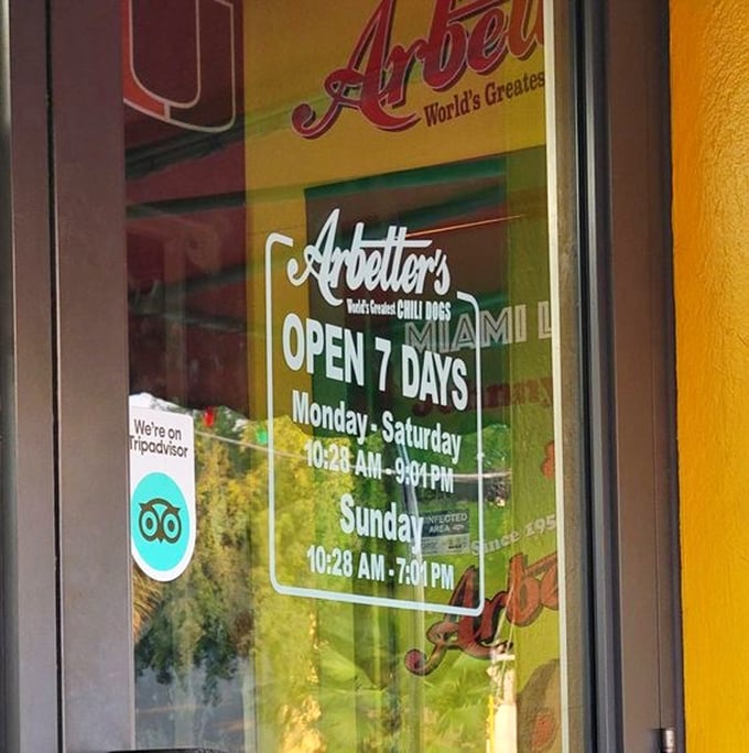 The door proudly announces "World's Greatest Chili Dogs" and seven-day availability—because hot dog cravings don't take weekends off.