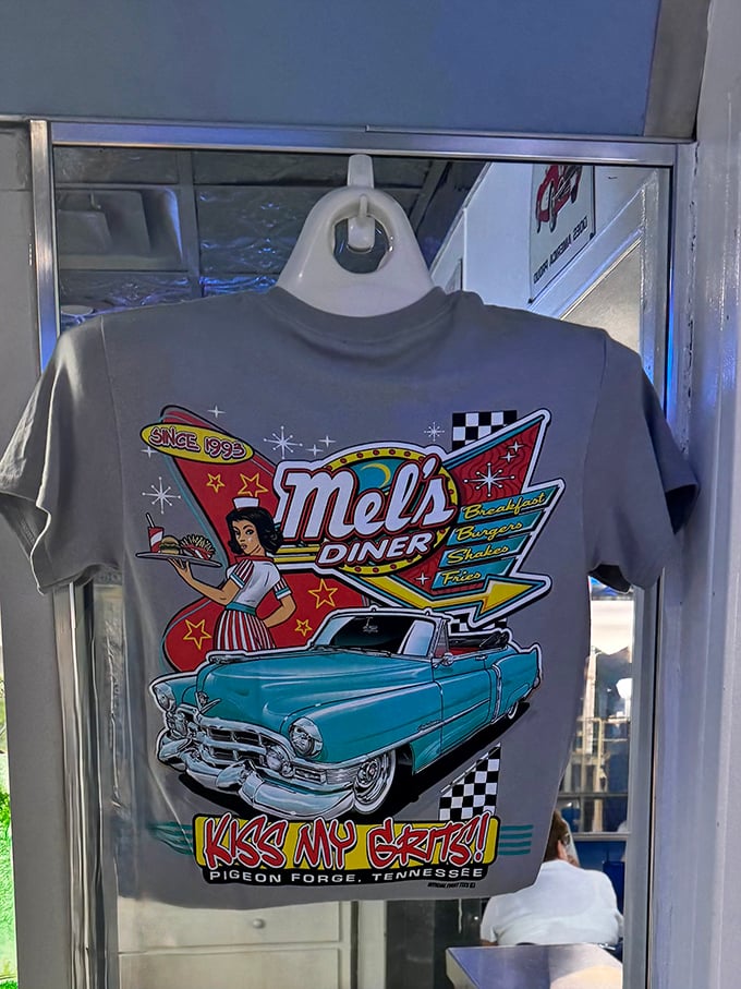 Souvenir t-shirts capture the essence of Mel's—classic cars, retro waitresses, and the promise of grits that might just change your life.