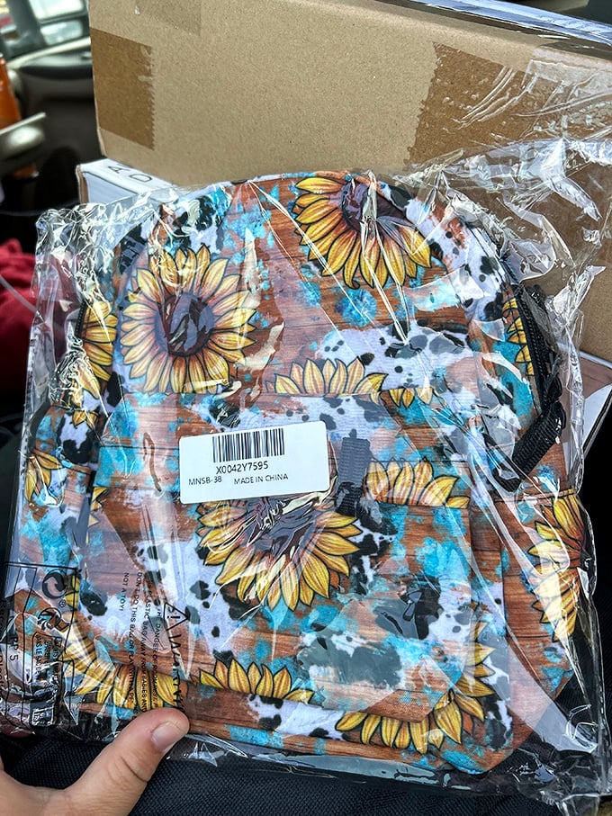Sunflower power in portable form! This cheerful little backpack carries more than just your essentials—it brings the sunshine wherever you go.