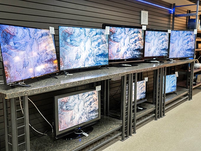 The electronics section requires a gambling spirit—these tested TVs display identical patterns, like a thrift store art installation.