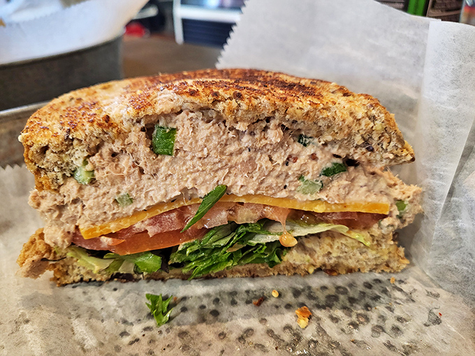This tuna sandwich has been elevated from sad desk lunch to work of art—layers of color and texture that would make your childhood lunch box weep with inadequacy.