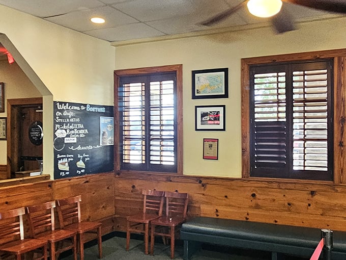 The waiting area's wooden paneling and chalkboard specials set the tone—unpretentious surroundings for extraordinary seafood.