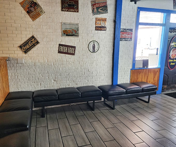 The waiting area's vintage signs and comfortable bench suggest that good things come to those who wait—especially when pulled pork is involved.