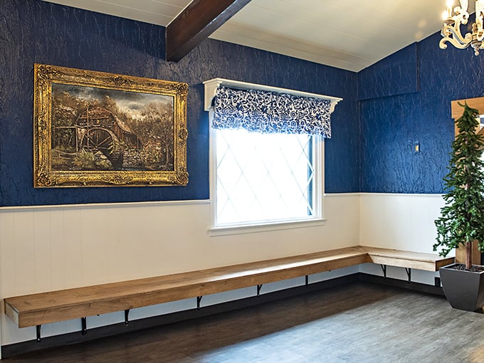 The waiting area's blue walls and classic artwork suggest you're not just waiting for food, but for an experience worth remembering.
