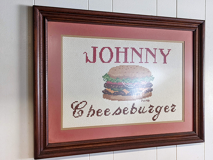 Cross-stitched burger art—because some masterpieces belong in frames, not museums. Grandma's hobby meets America's favorite food.
