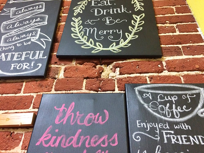Wall art that reminds you to "throw kindness around" while enjoying coffee with friends—life lessons served alongside breakfast.