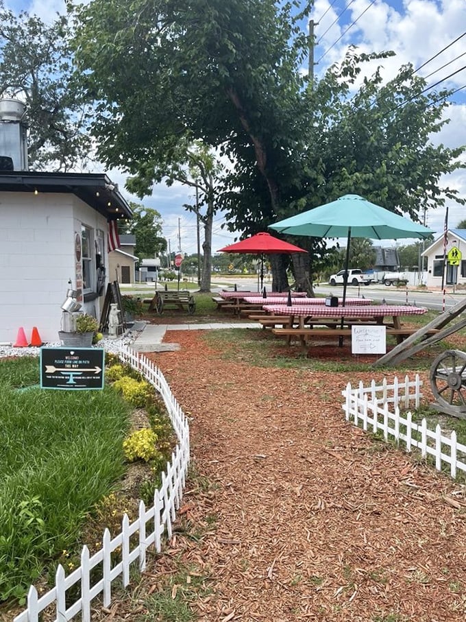 A welcoming path lined with white picket fencing – like Grandma's house, if Grandma was a pitmaster with serious smoking skills.