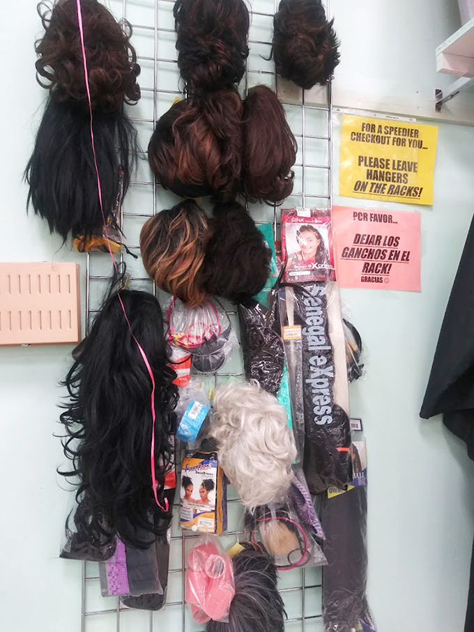The wig wall: where transformation is just a try-on away. Halloween solutions or bold style statements—you decide!