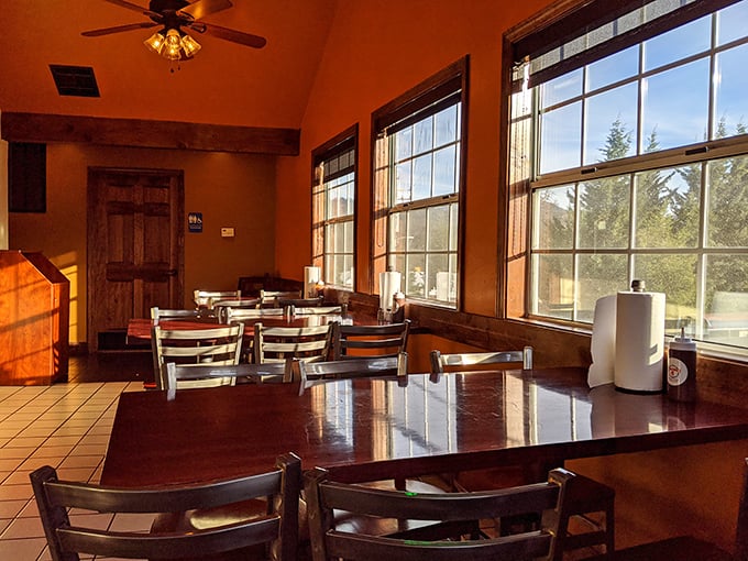 Warm wood tones and natural light create a dining room that feels like eating at a friend's mountain cabin – if your friend happened to be a barbecue genius.