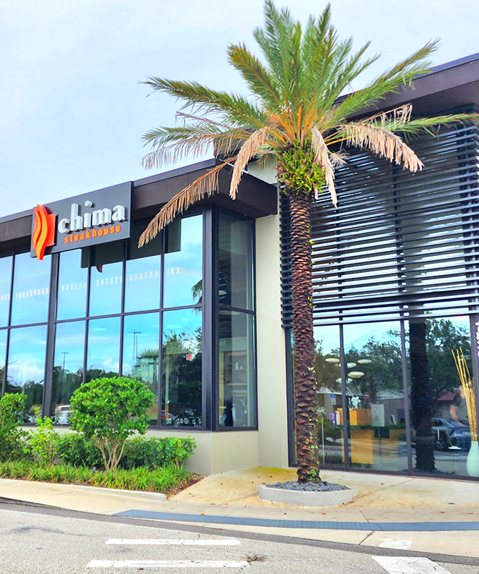 Chima's sleek glass exterior with that signature palm tree is Florida modernism meets Brazilian tradition—like samba dancing in a space station.