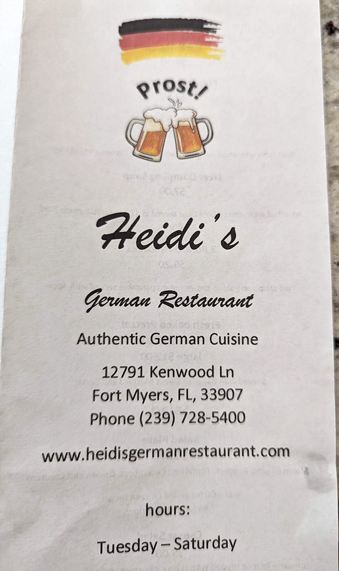 The menu cover says it all – authentic German cuisine awaits. That German flag and clinking beer mugs are basically a taste preview.