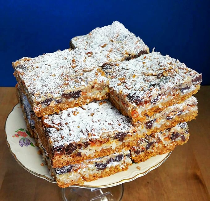 Seven-layer bars stacked with such precision they could teach architecture classes. Each square contains a universe of sweetness.