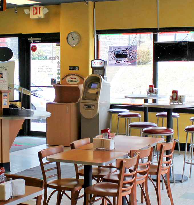 The dining area's ATM stands ready for those moments when you realize one pizza simply won't be enough for today.