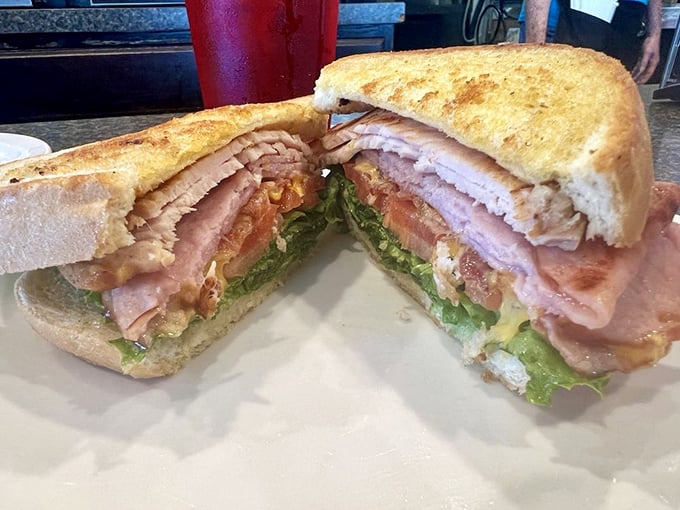 The Airporter sandwich: a towering achievement of ham, turkey, and bacon that makes you wonder why you'd ever order anything else.
