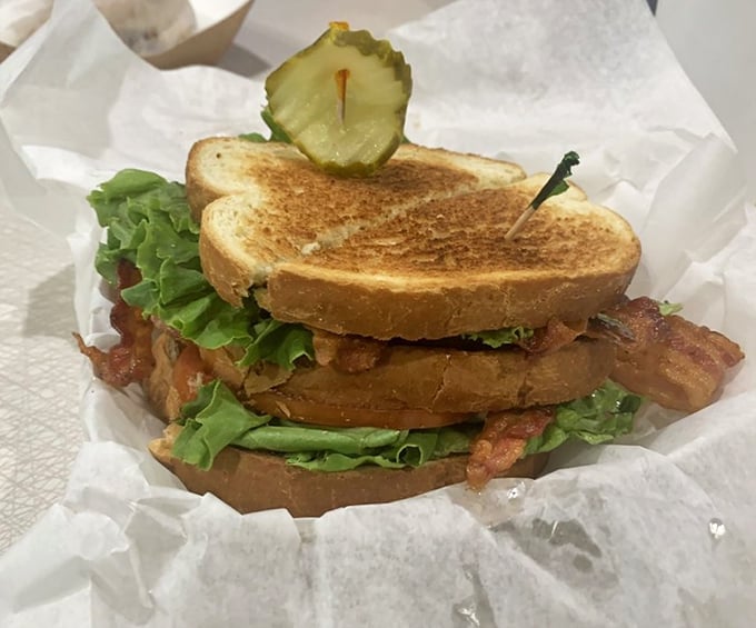 This isn't just a BLT; it's architecture – layers of crispy bacon, garden-fresh lettuce, and juicy tomato between perfectly toasted bread.