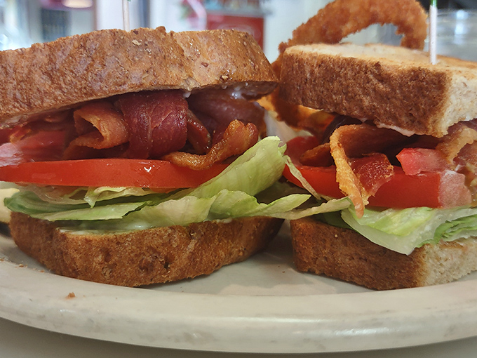 The BLT—a sandwich so perfect it needs only initials. Pop's version showcases the holy trinity of bacon, lettuce, and tomato on toasted bread.