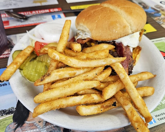 A proper diner burger doesn't need fancy aioli or artisanal buns – just honest ingredients, proper cooking, and enough fries to share (but you won't want to).