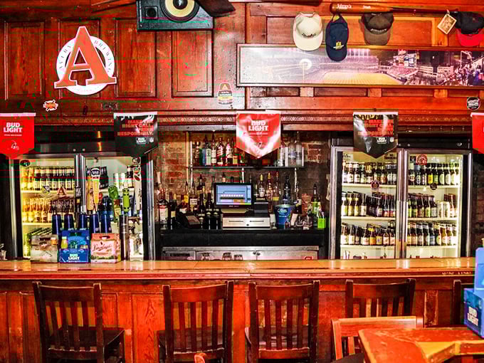 The bar itself—command central for cold beer and burger anticipation. Those refrigerators hold liquid happiness to complement your meal.