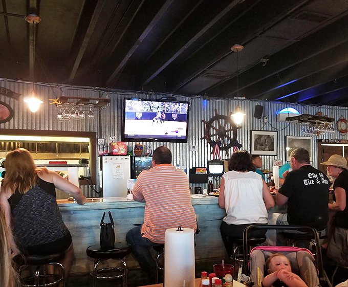 At the bar, sports on TV and cold beer on tap—because great seafood deserves the company of simple pleasures.