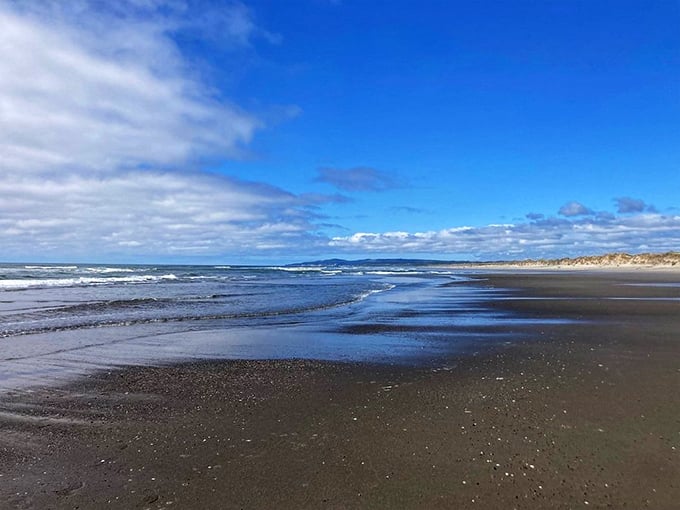 The meeting point of sand and sea—where footprints disappear with each wave, but memories of this coastline remain permanently imprinted.