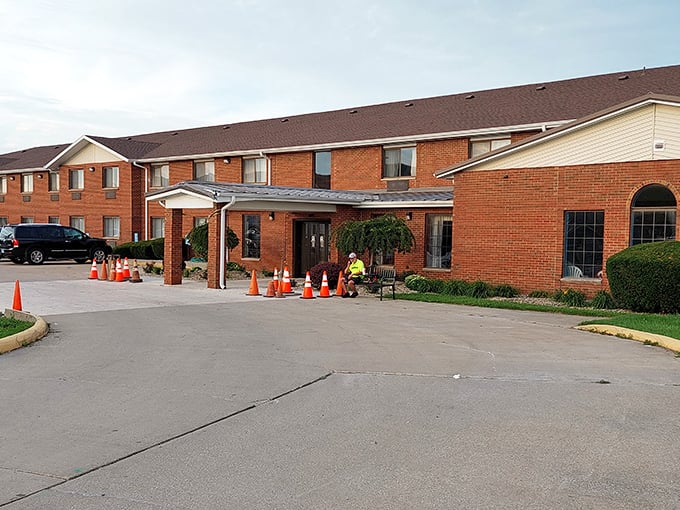The Best Western might not win architectural awards, but those orange cones suggest they're improving—just like the rest of us, always under construction.