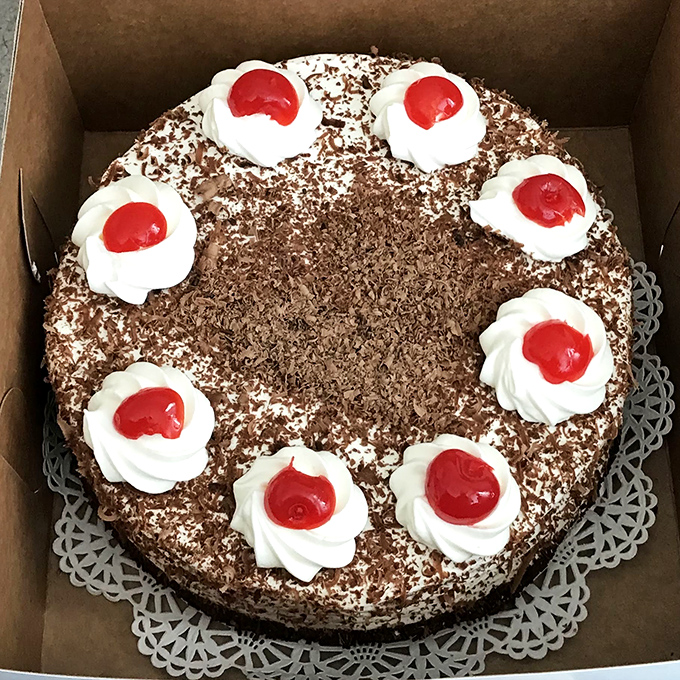 This Black Forest Torte isn't just cake—it's a German cultural ambassador with diplomatic immunity from your diet. Those cherries are practically winking at you.