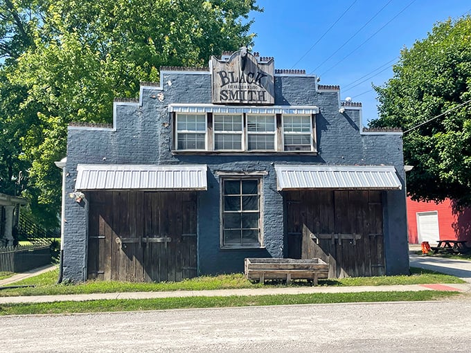 The blue Blacksmith Shop stands as a working monument to craftsmanship, where fire and iron once shaped the tools of everyday life.