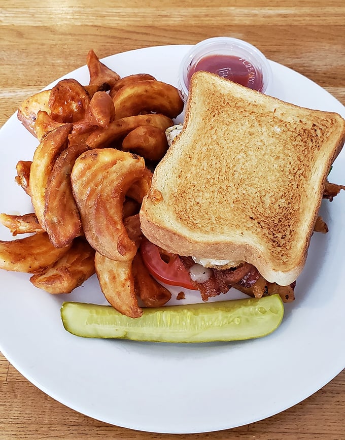 The BLT that launched a thousand return visits, with home fries that make you question every other potato you've ever eaten.