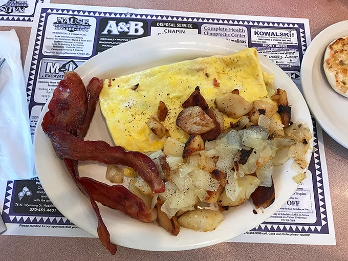 This breakfast platter speaks the universal language of "You won't need lunch today" with its generous portions and perfect execution.