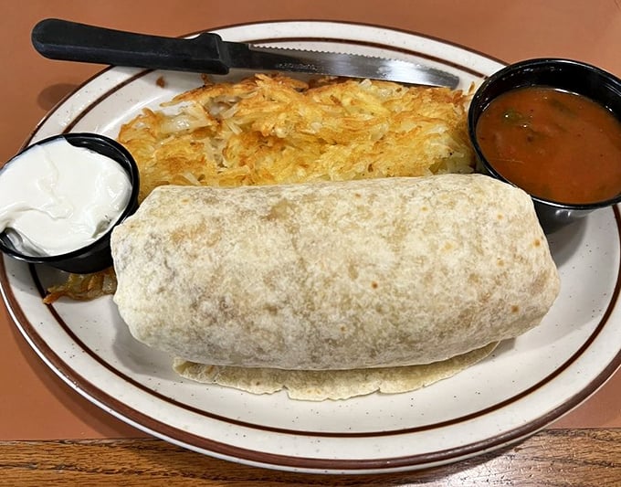 The breakfast burrito that could fuel you through an apocalypse. Crispy hash browns, sour cream, and that perfect side of salsa.