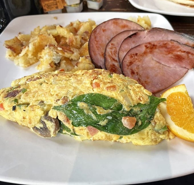 An omelet that's not afraid to show its colorful personality, with ham playing the perfect supporting role.