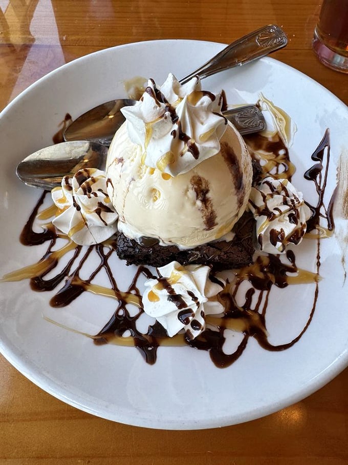 A brownie sundae that understands the importance of proper ice cream-to-chocolate ratio. The whipped cream is just showing off at this point.