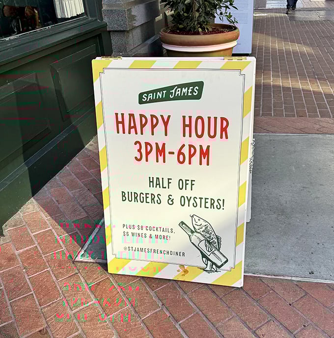 Happy Hour sign that doesn't just promise discounts—it offers an affordable gateway drug to a full-blown French diner addiction.