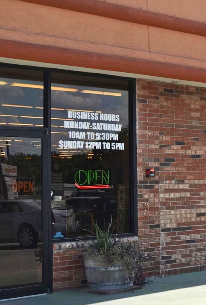 Business hours posted clearly on the window invite visitors to plan their antiquing adventures, with seven days of treasure-hunting possibilities.