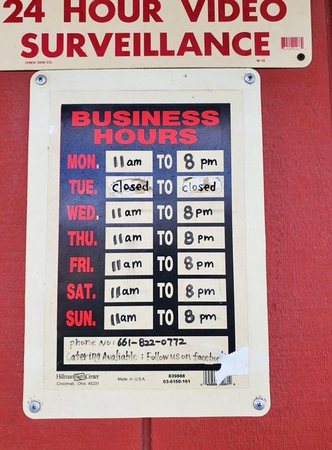 The hours sign tells a simple truth—closed Tuesdays because even BBQ masters need a day to rest (or smoke more meat for Wednesday).
