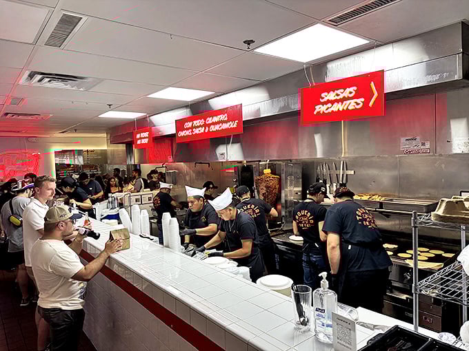 A bustling kitchen during peak hours—where skilled hands work with practiced precision to feed Austin's seemingly insatiable taco appetite.