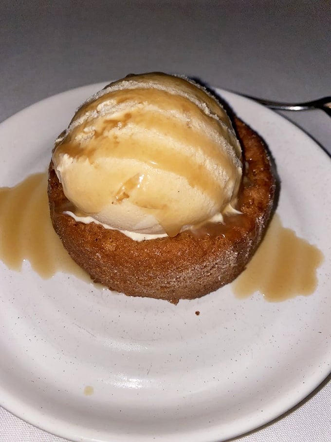 A butter cake topped with ice cream that doesn't just end your meal—it provides closure, therapy, and a moment of pure, melting bliss.
