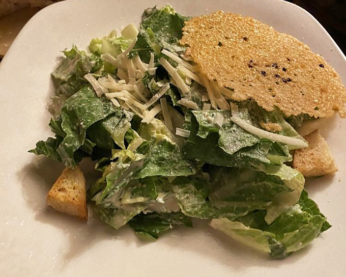 A Caesar salad that Julius himself would approve – crisp romaine, sharp Parmesan, and that golden Parmesan crisp crown.